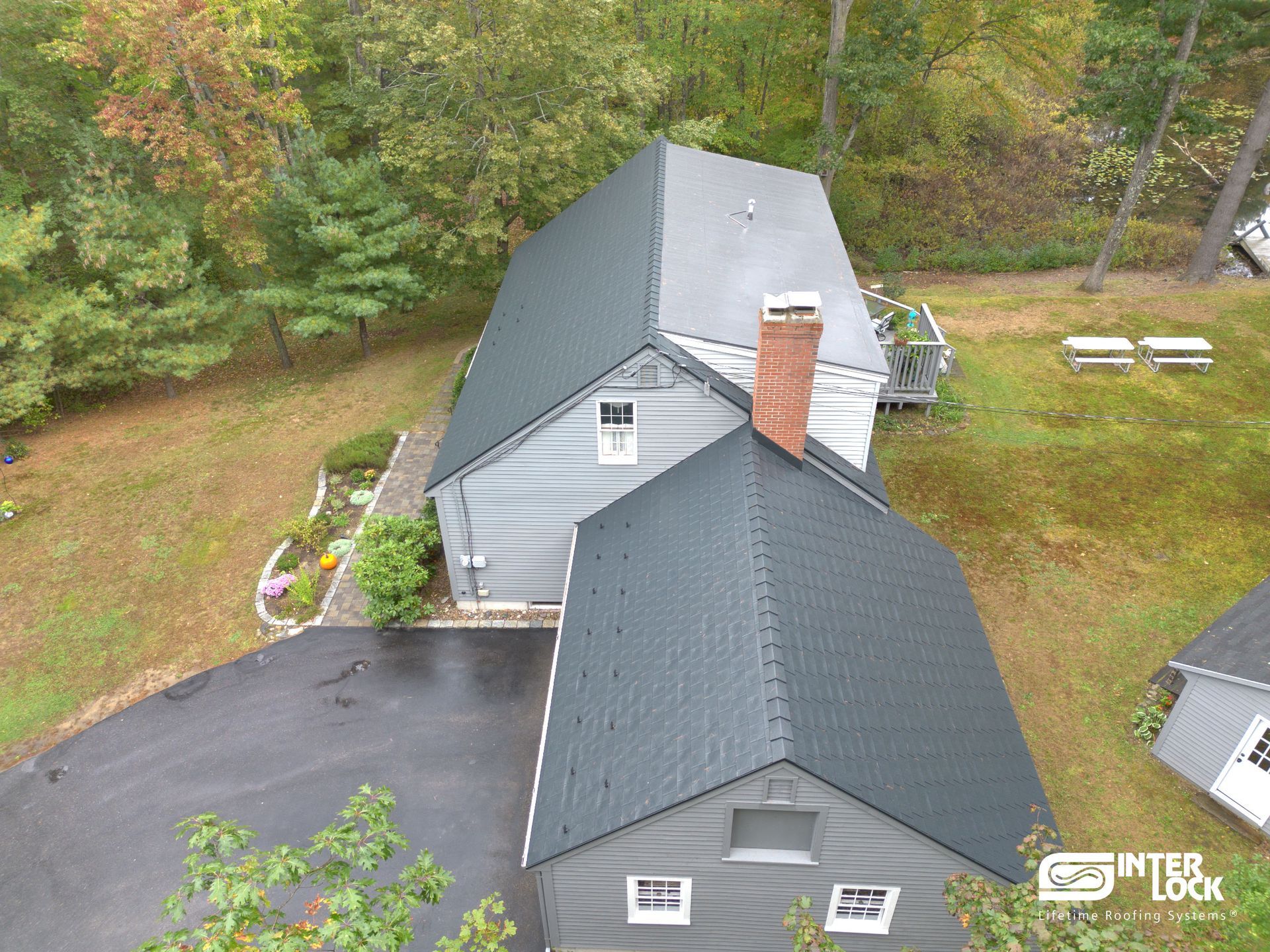 Black Interlock Metal Slate Roofing System Installed on Rochester, NH Home