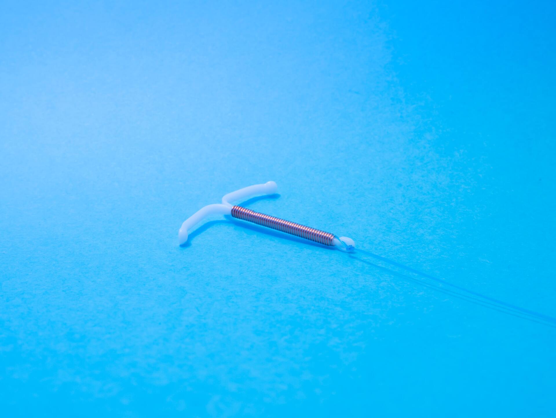 How does a copper IUD protect patients from unwanted pregnancy?
