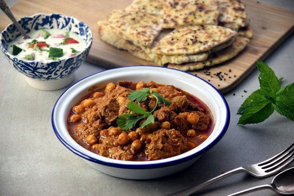 Hogget curry served with minty flatbreads & a raita