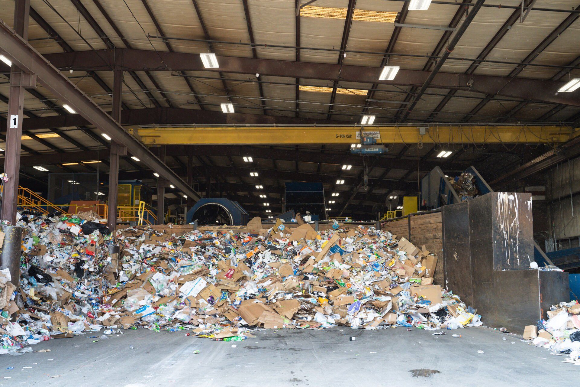 How do waste companies responsibly bury & manage incoming trash?